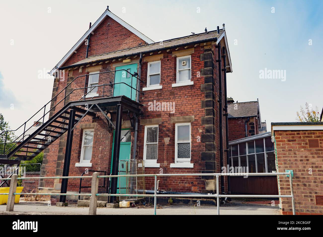 A low angle shot of a historic brick hospital building in North ...