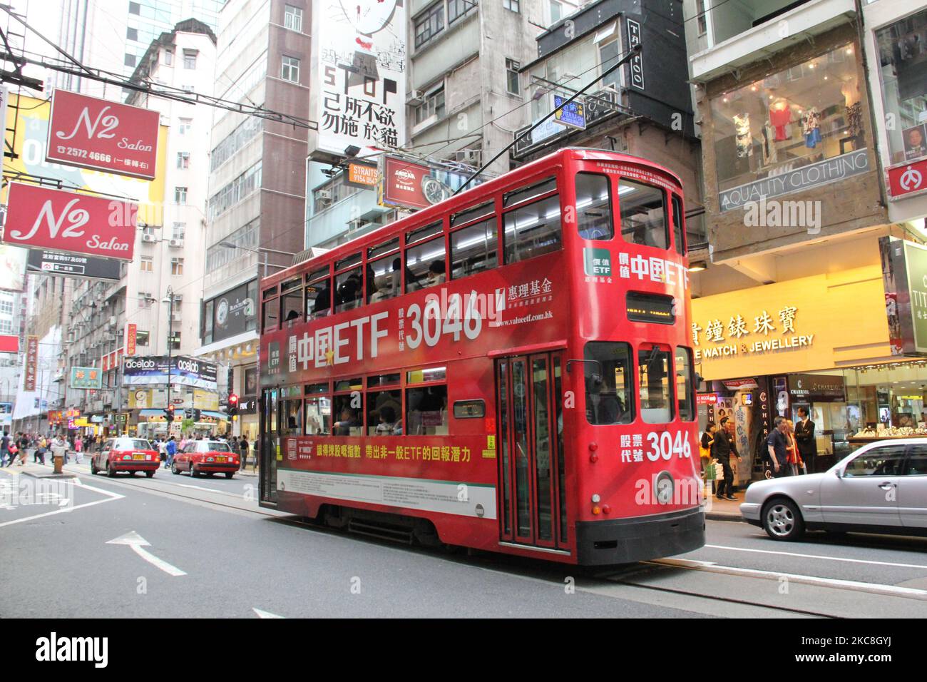 A red double-decker bus Ding Ding on a road in downtown Hong Kong Stock ...