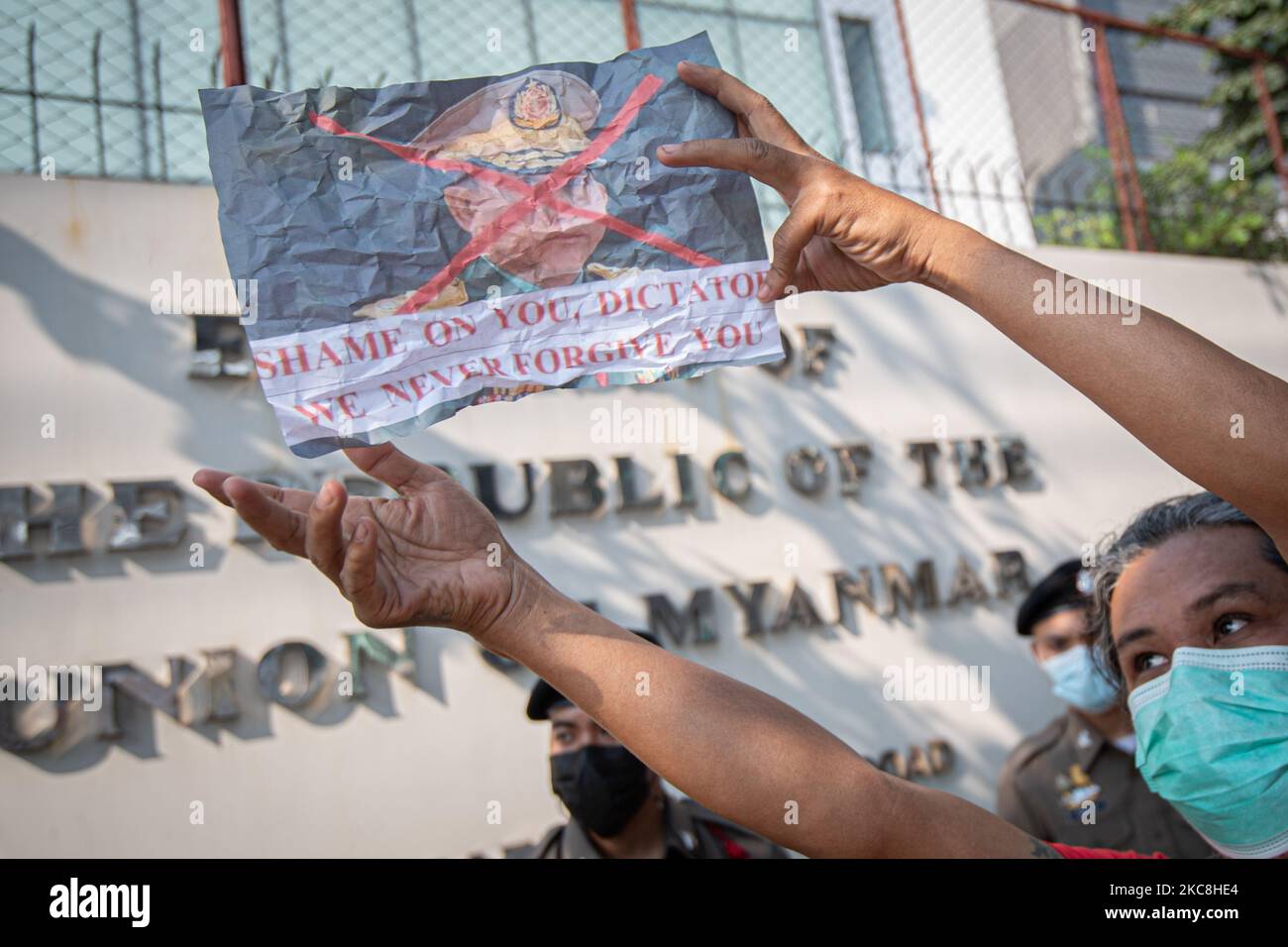 NLD supporter holds up a picture of Myanmar's army chief Min Aung ...