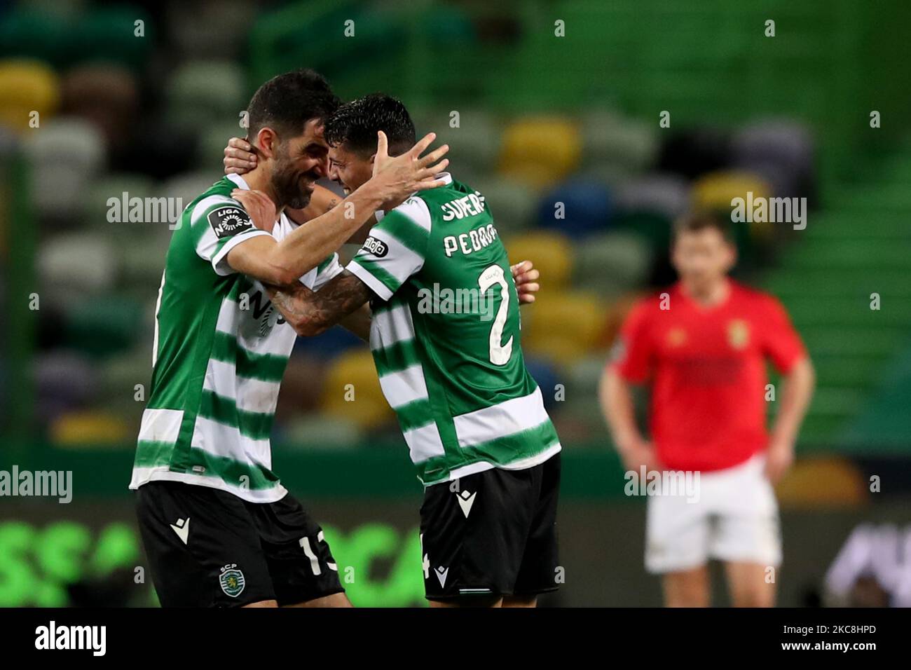 Luis Neto of Sporting CP (L) celebrates with Pedro Porro during the ...