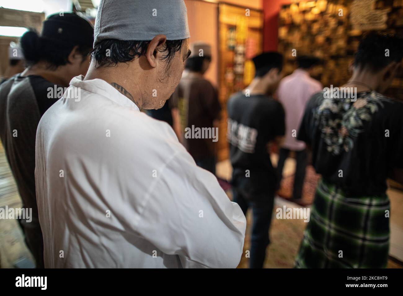 A student with his friends pray together. Islamic boarding school for ...