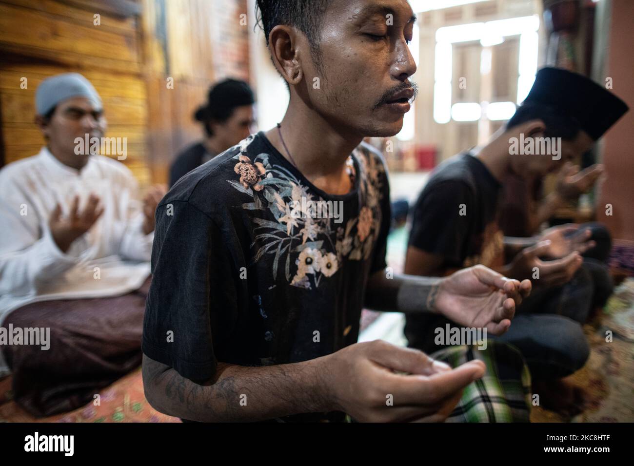 A student with his friends after pray. Islamic boarding school for punk ...