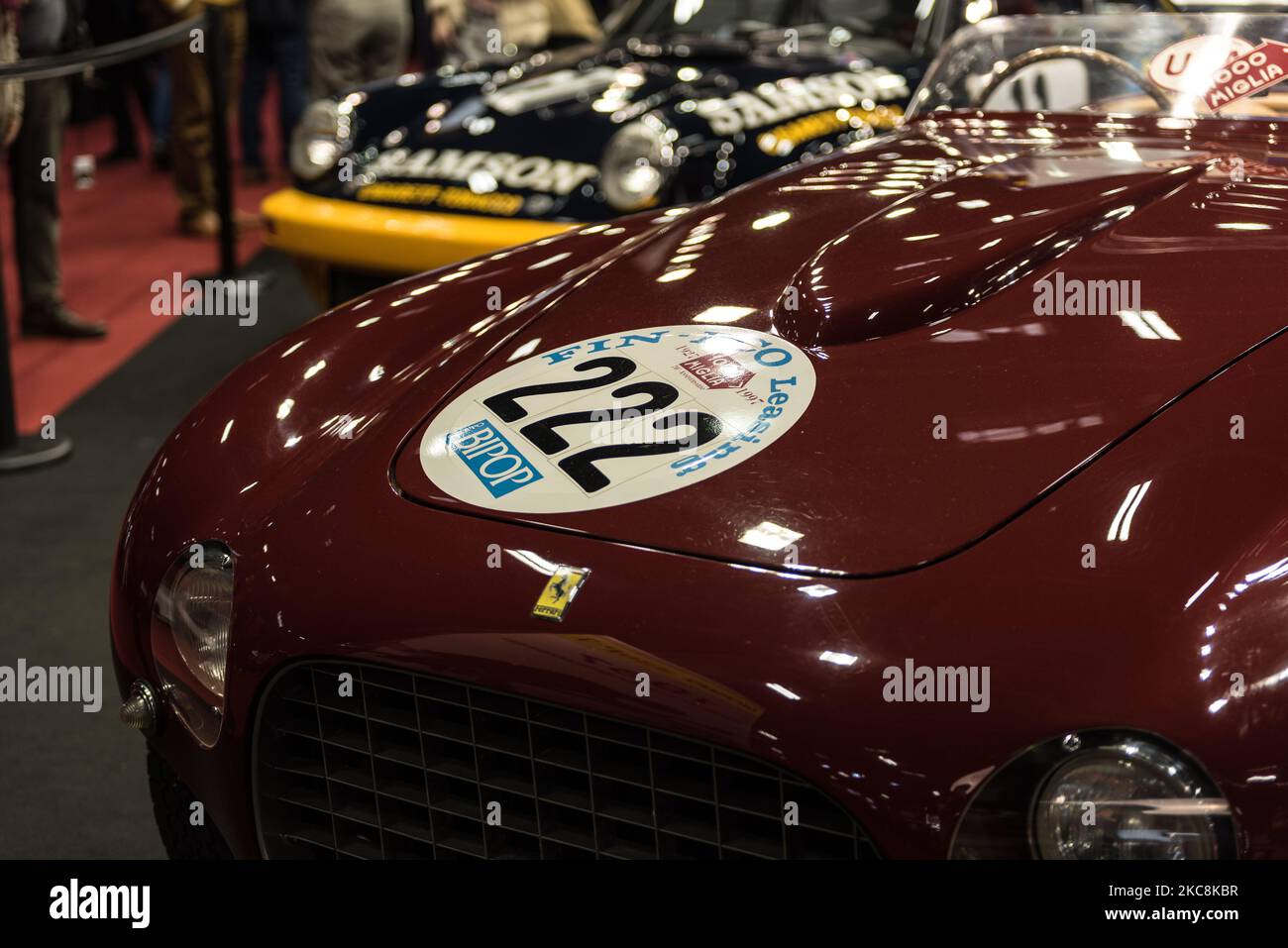 A shallow focus front three-quarter view of the red Ferrari racecar ...