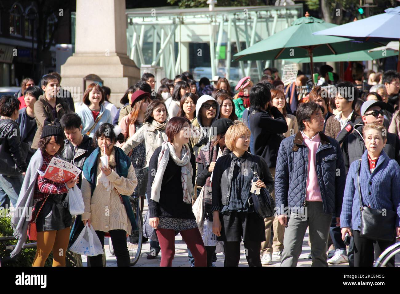 A crowd of stylish people at a crosswalk in Omotesando in Tokyo, Japan ...