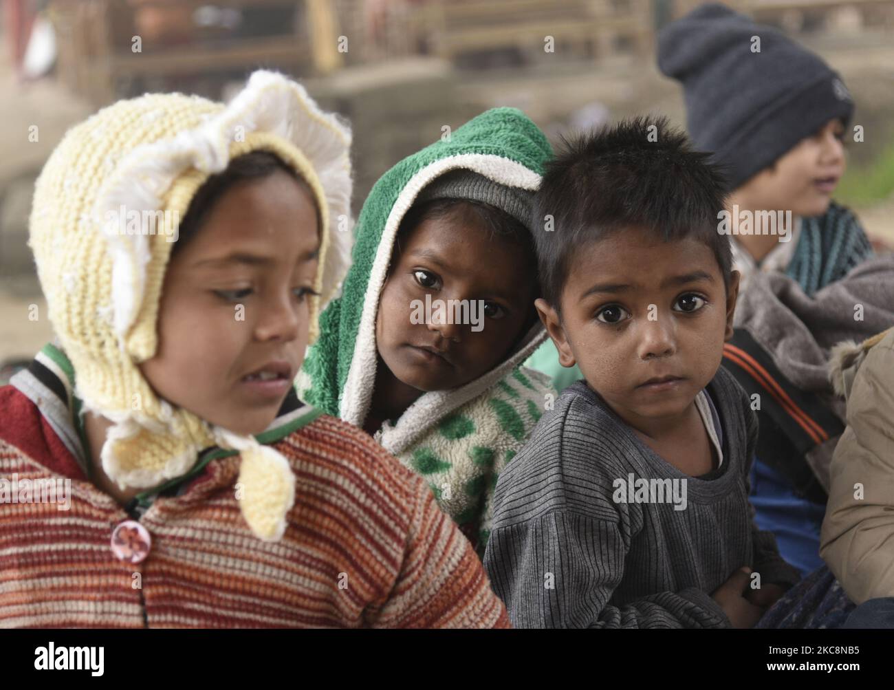 Underprivileged children study at an improvised classroom set up under ...