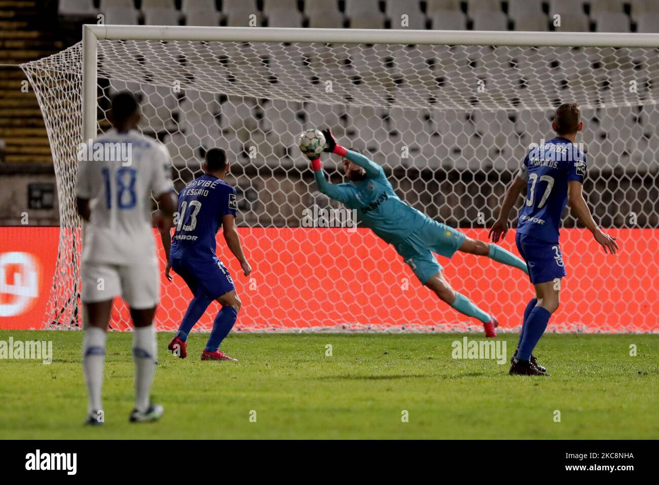 Belenenses SAD's goalkeeper Stanislav Kritciuk (C ) makes a safe during ...