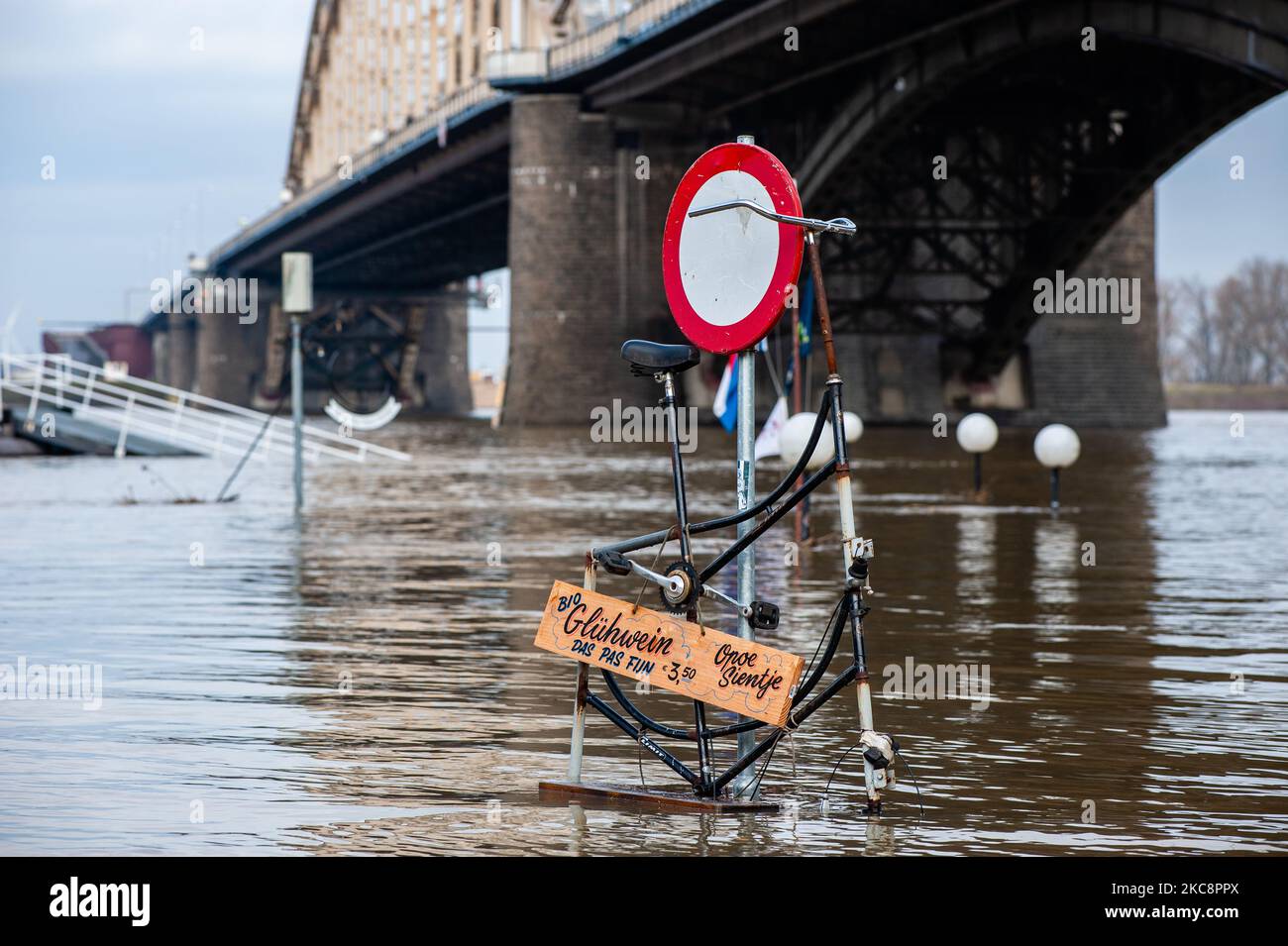 A traffic sign and a bike are almost underwater, during the high water ...