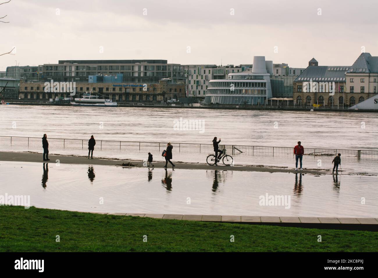 people enjoy playing water at flooded area as Rhine river water level ...