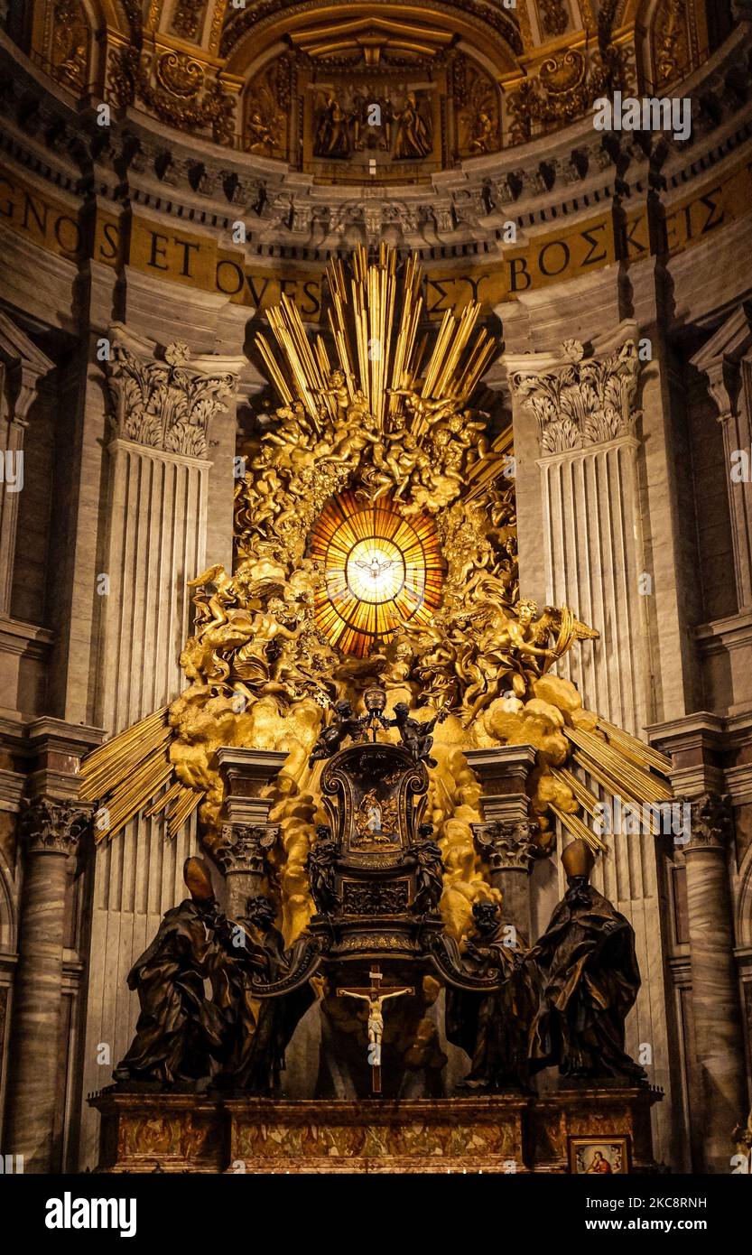 A close-up of a gold-plated throne surrounded by gargoyles with ancient ...