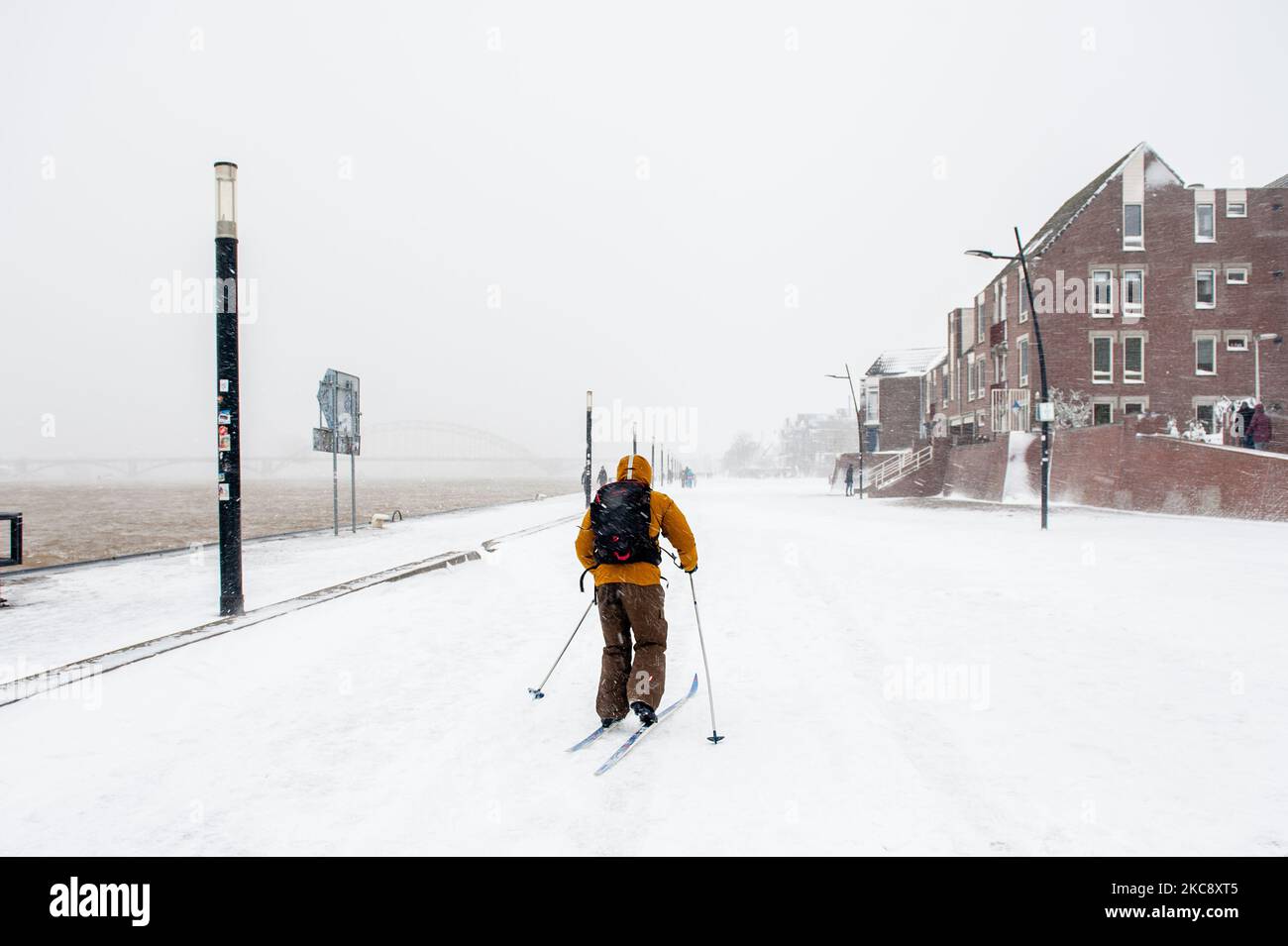 A man is skiing on the snow during the snowstorm called Darcy, in ...