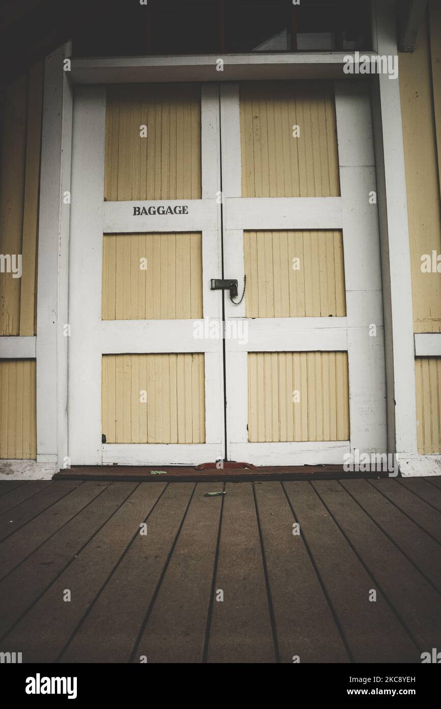 A vertical shot of old wooden doors in the abandoned town of Thurmond ...