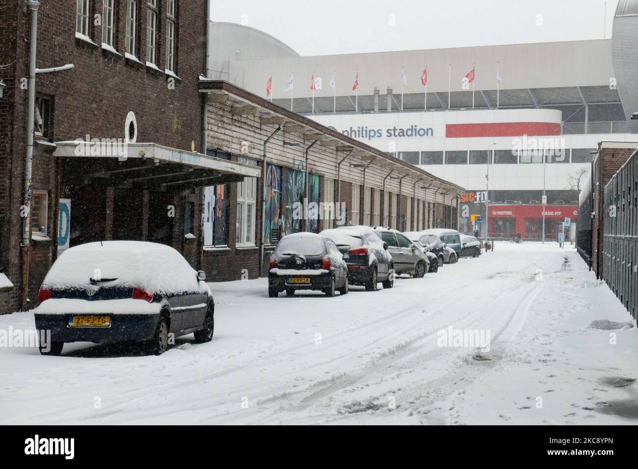 Snow covered street with PSV Philips Stadion Stadium in the background ...