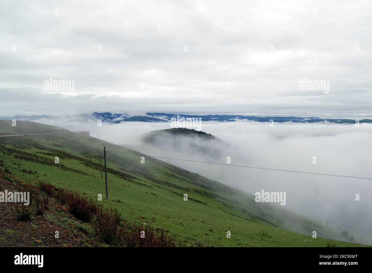A beautiful view of a green hill with a cloudy sky background Stock ...