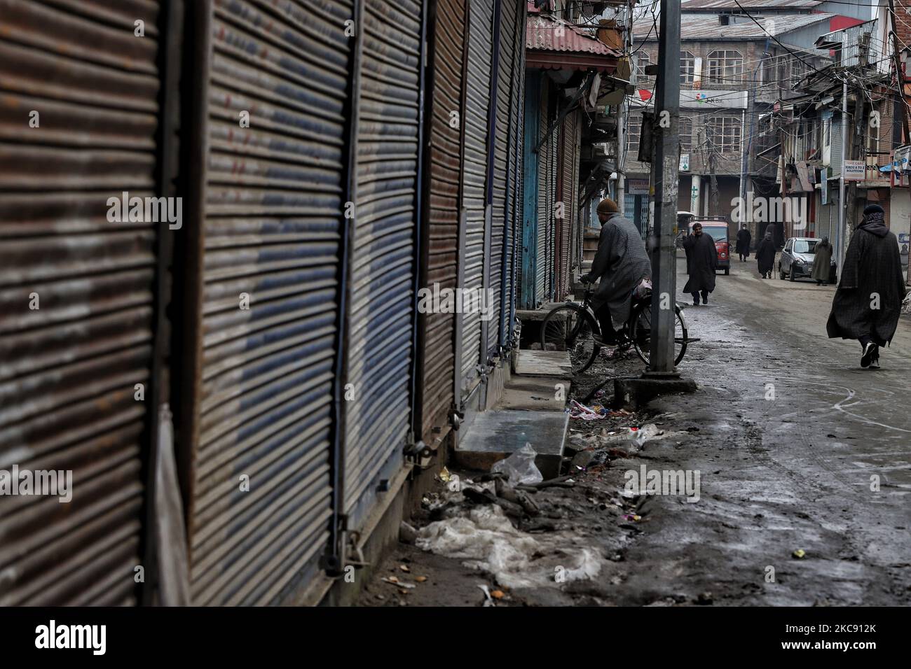 Kashmiris walk as Shops remained closed in Sopore Town of District ...