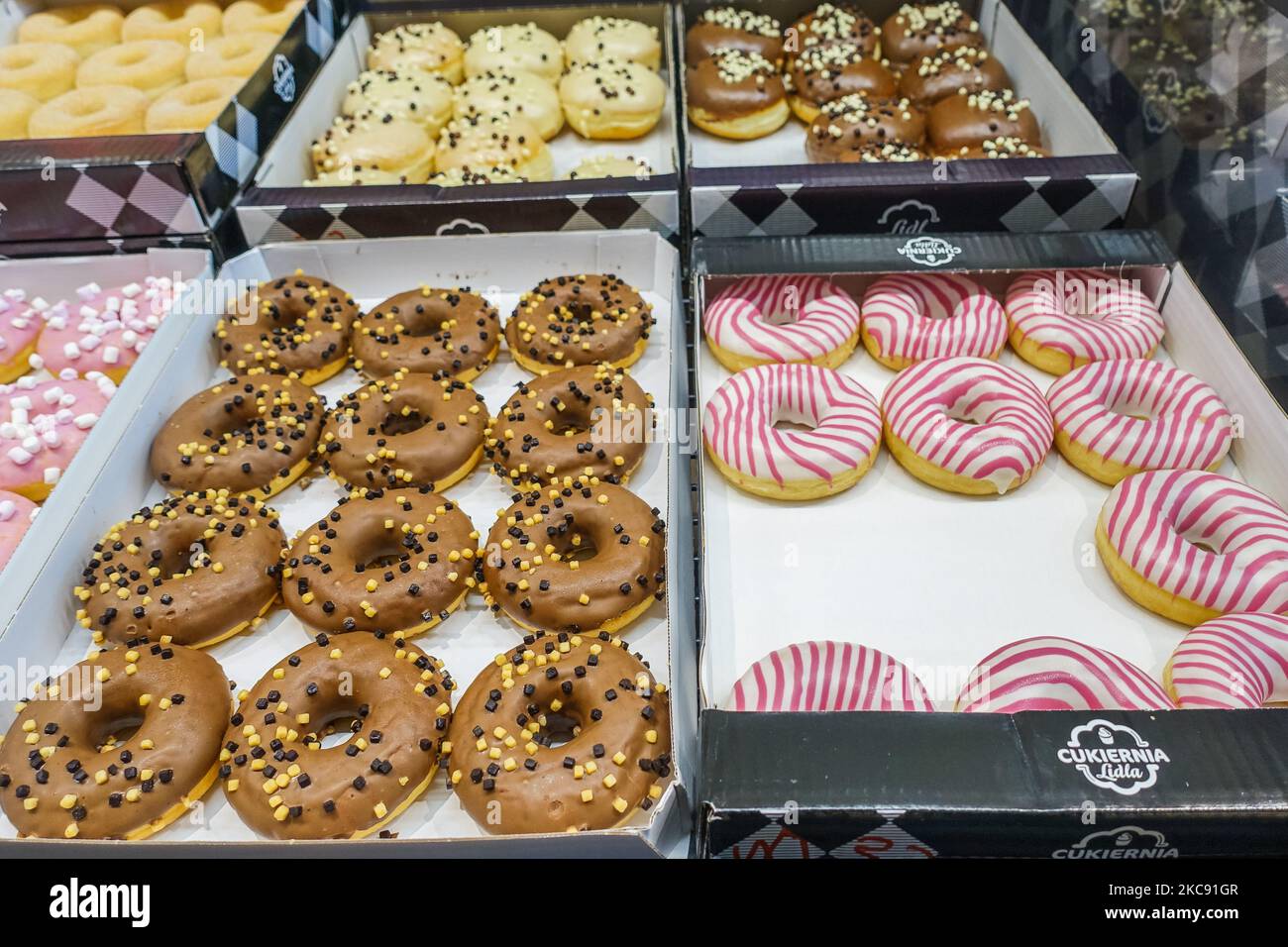 Paczki - traditional fist-sized donut filled with rose, strawbery or ...