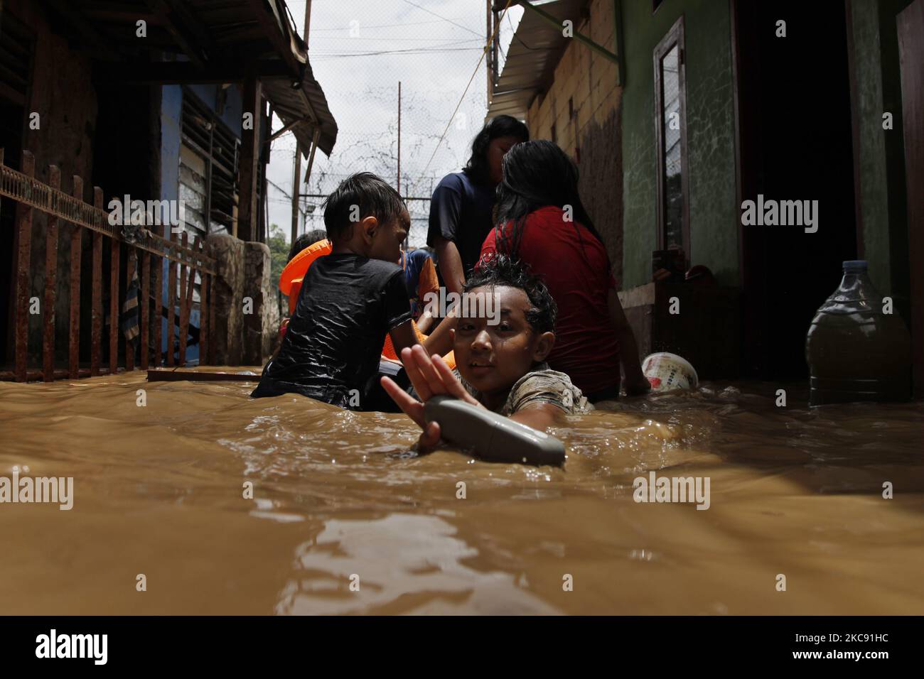 Children playing in flood water hi-res stock photography and images - Alamy