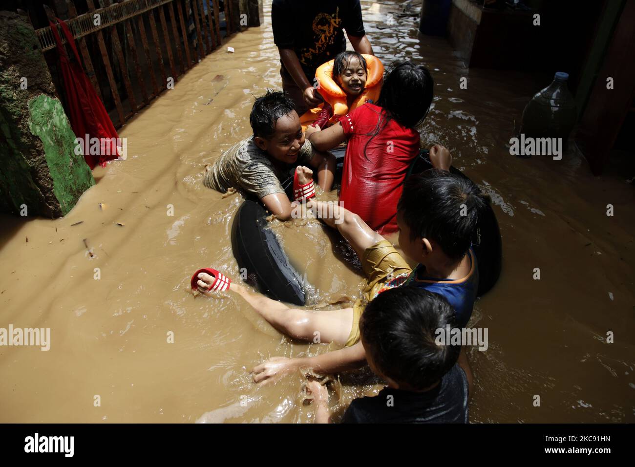 Children playing in flood water hi-res stock photography and images - Alamy
