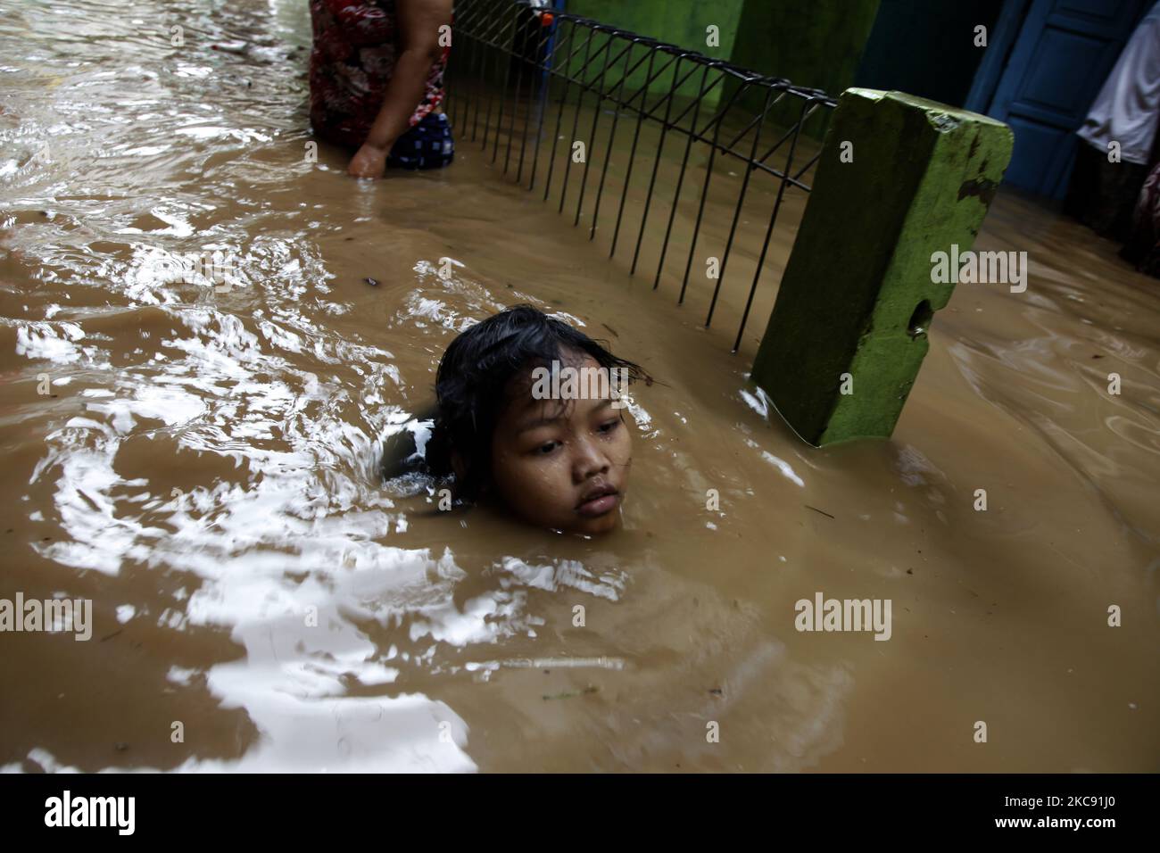Children playing in flood water hi-res stock photography and images - Alamy