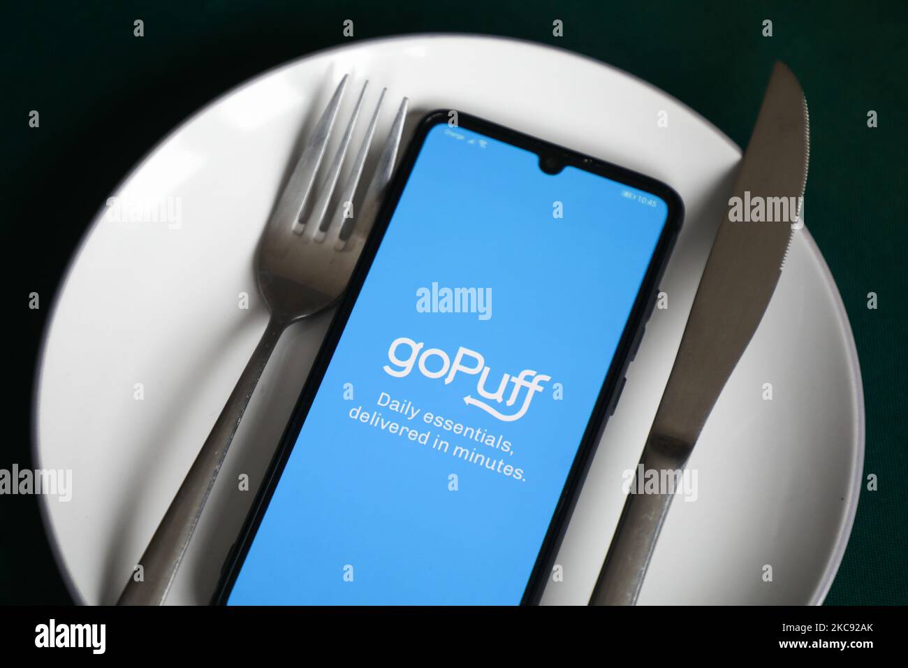 GoPuff app logo is displayed on a mobile phone screen photographed for ...