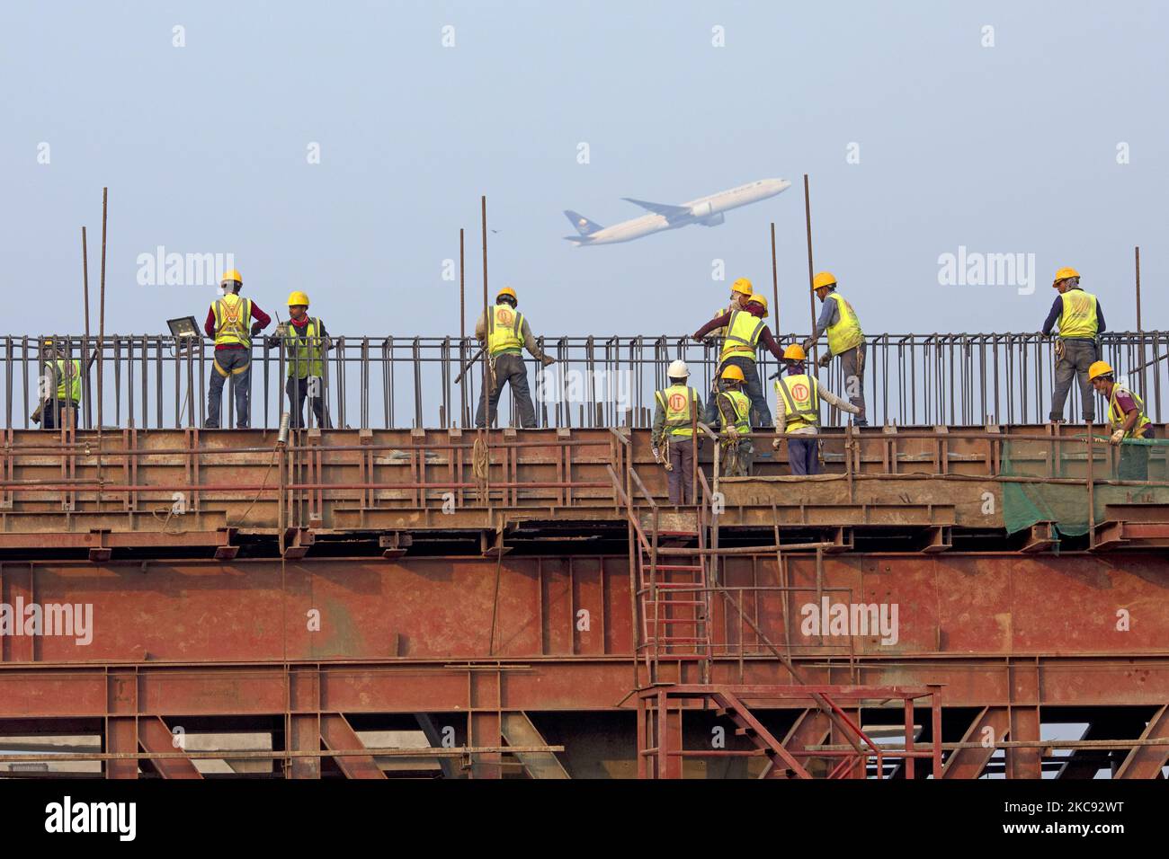 Construction workers work on the country's first metro-rail project in ...