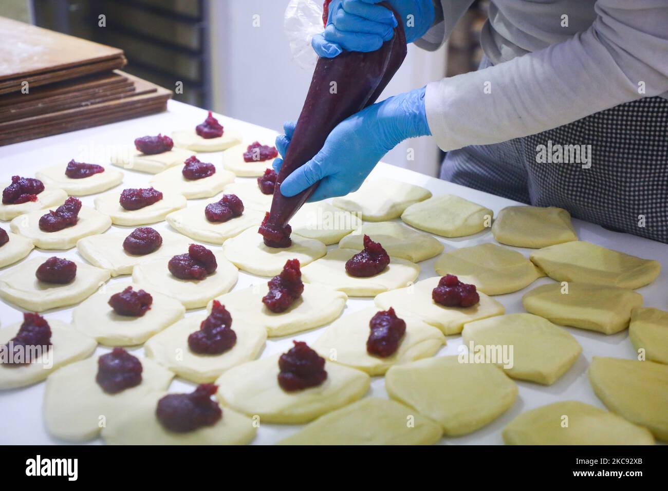 Bakery 'Dobra Paczkarnia' produces donuts for Fat Thursday. Krakow ...