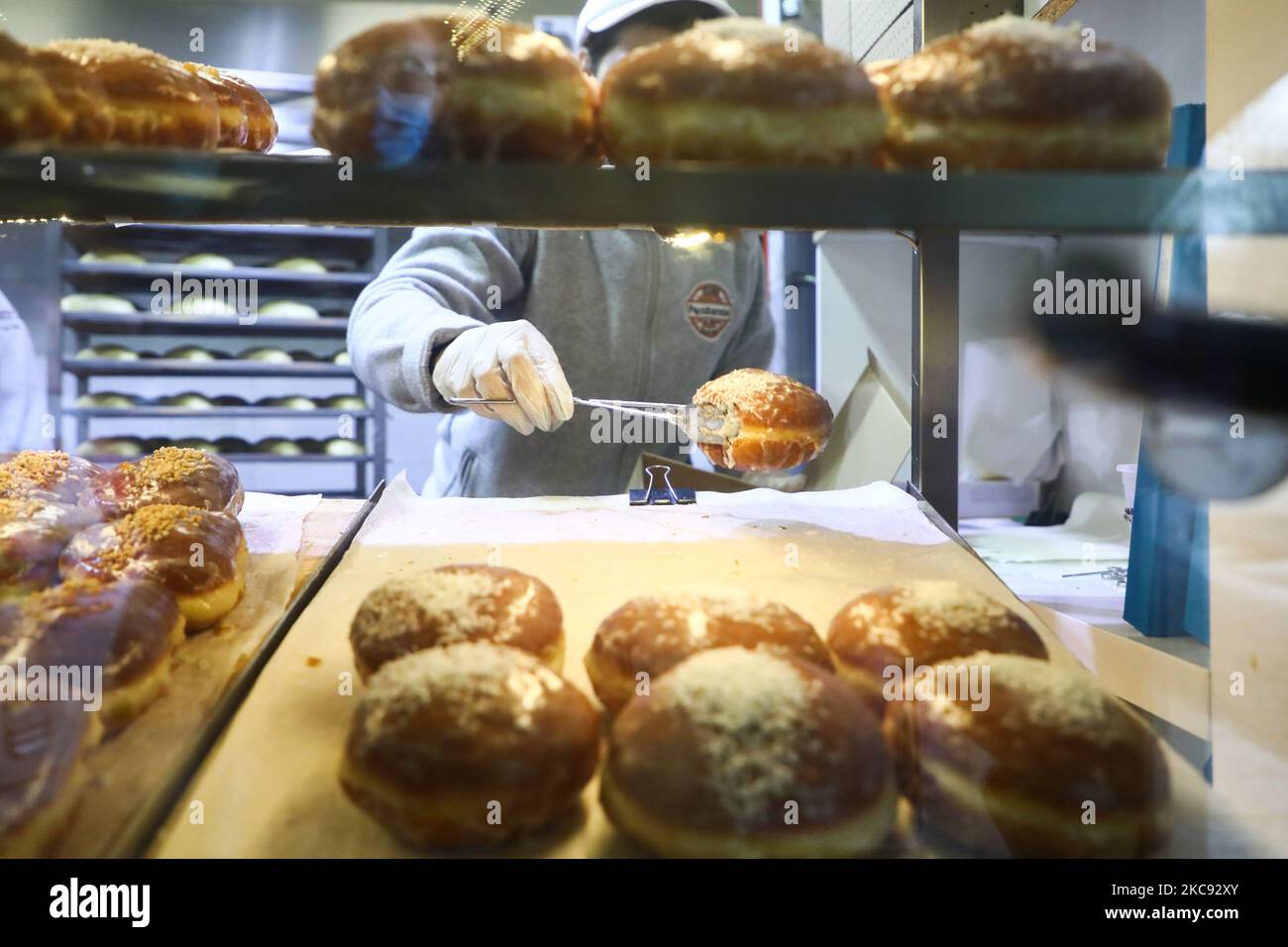 Bakery 'Dobra Paczkarnia' produces donuts for Fat Thursday. Krakow ...