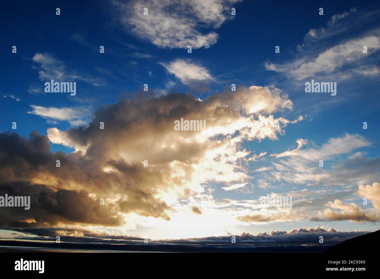 A beautiful view of clouds in a bright blue sky Stock Photo - Alamy