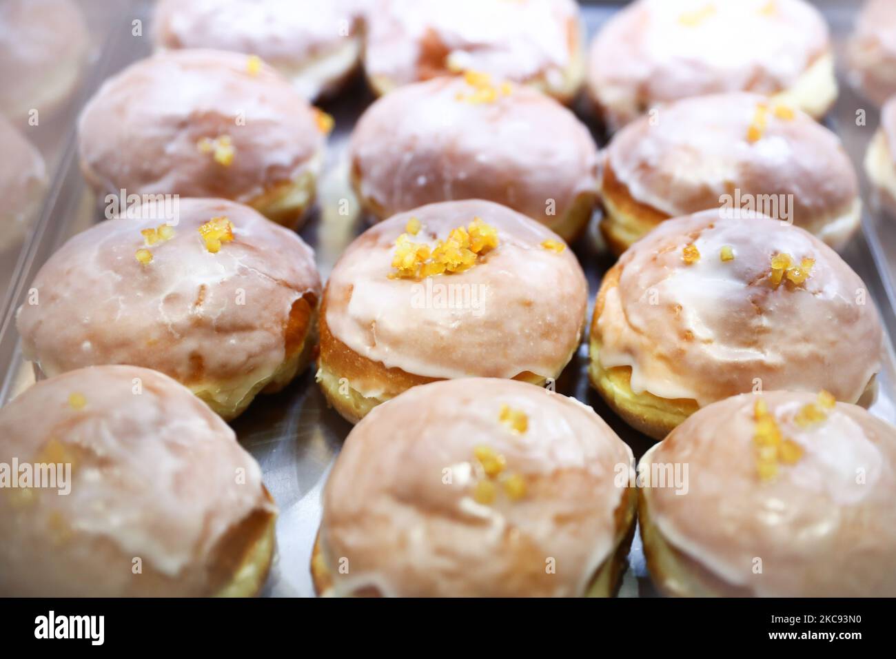 Traditional donuts for Fat Thursday are on a display in a bakery in ...