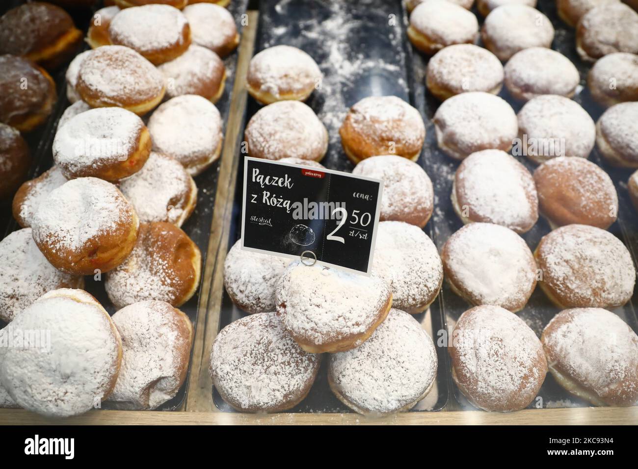 Traditional donuts for Fat Thursday are on a display in a bakery in ...