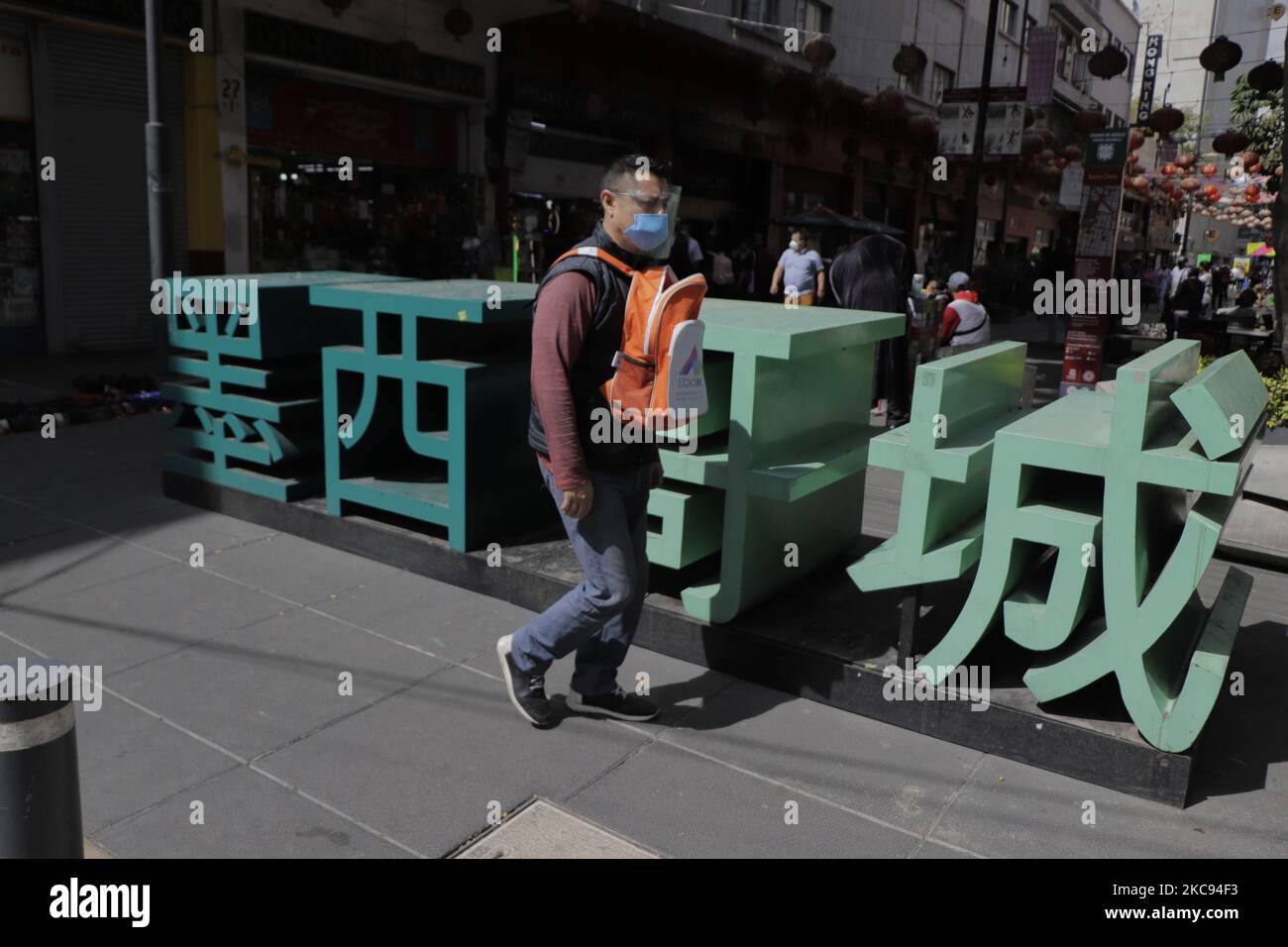 A passerby walks through the Chinatown of Mexico City, as part of the ...