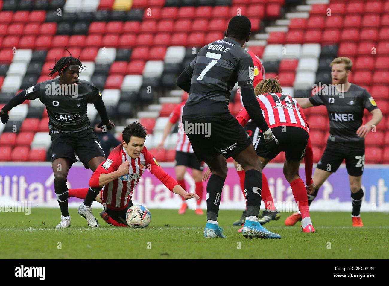 Luke O'Nien of Sunderland does down after battlling for possession with ...