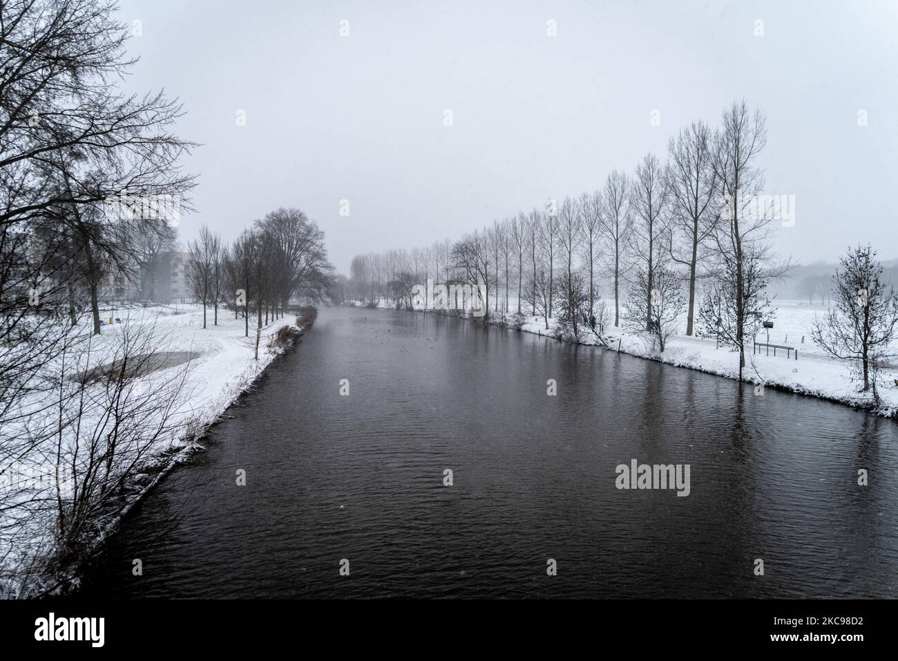 The river 'de Vecht' in a very cold snowstorm, Utrecht, Netherlands ...