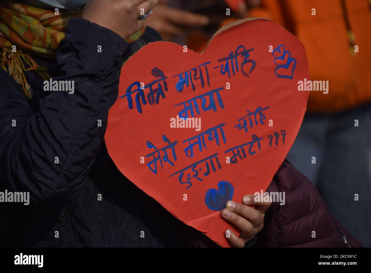 Nepalese people hold placard along with love slogans during Valentine’s ...
