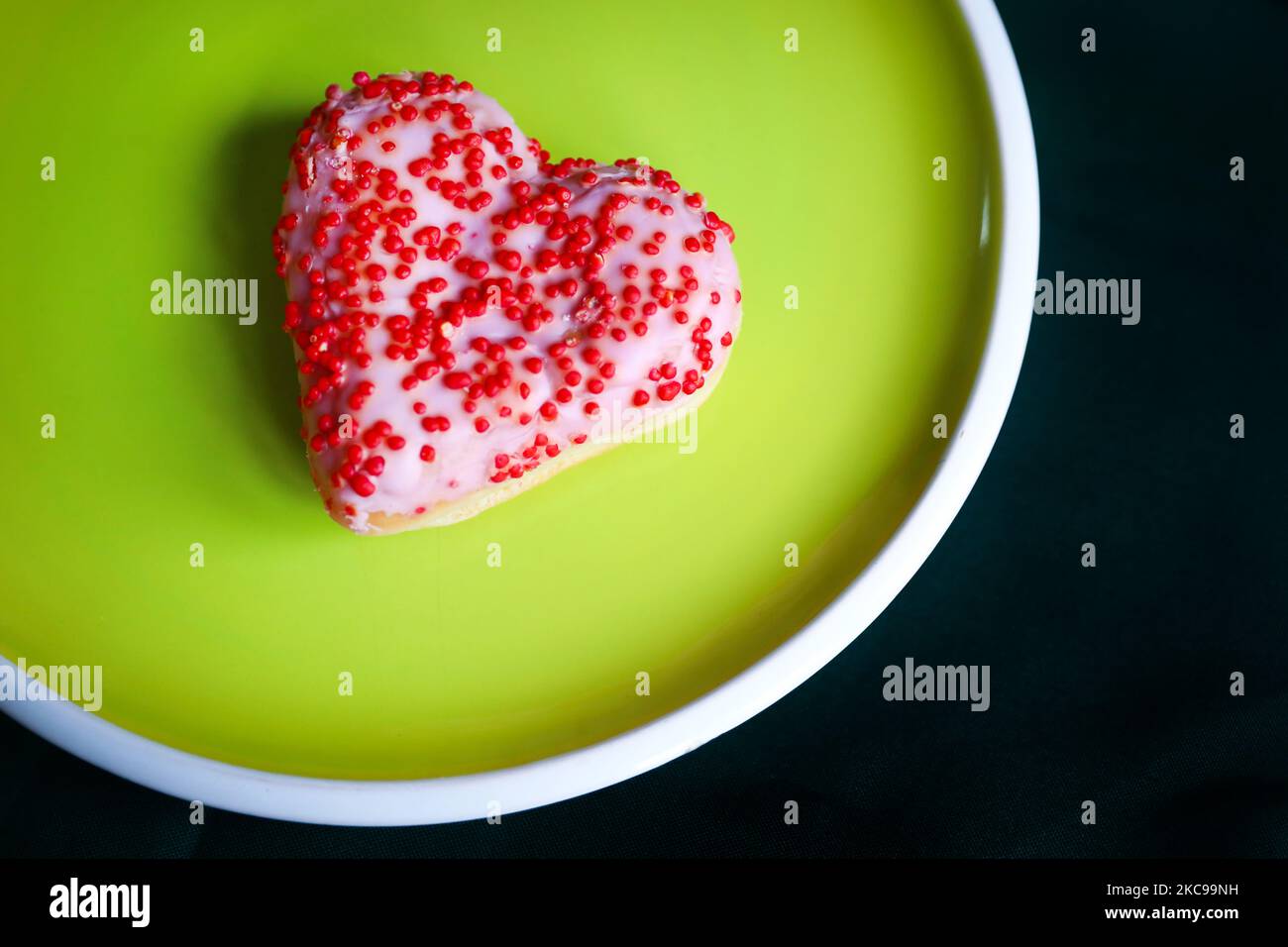A heart shaped donut is pictured as an illustration of St. Valentine's ...