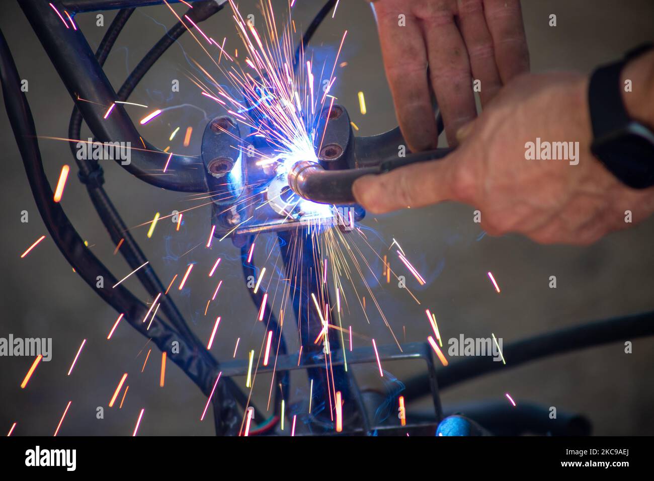 A closeup of sparks of welding Stock Photo - Alamy