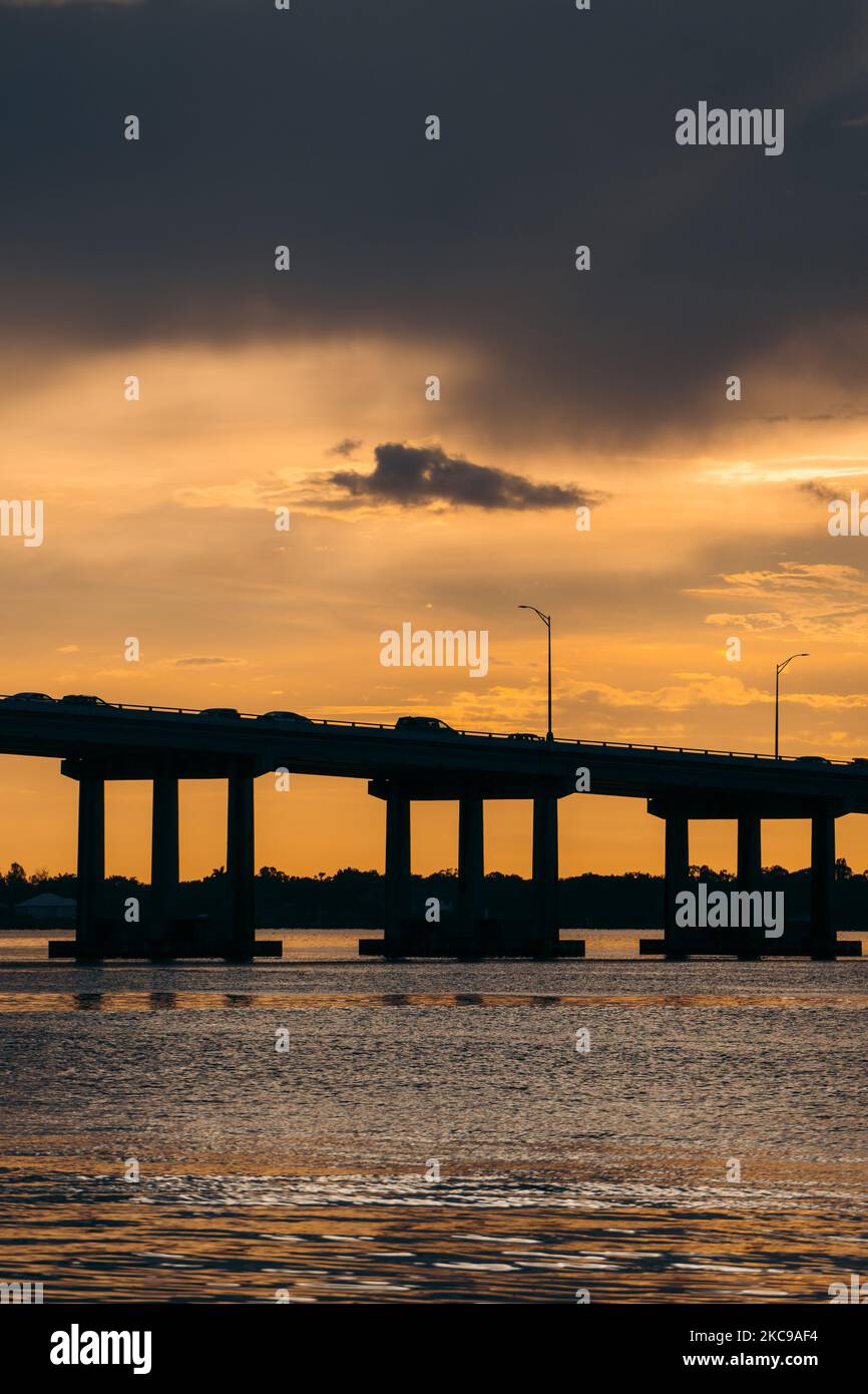 A silhouette of bridge over Caloosahatchee river during sunset Stock ...