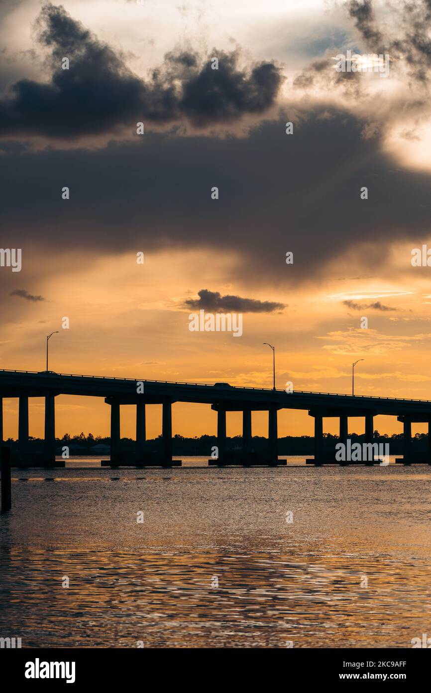 A silhouette of bridge over Caloosahatchee river during sunset Stock ...