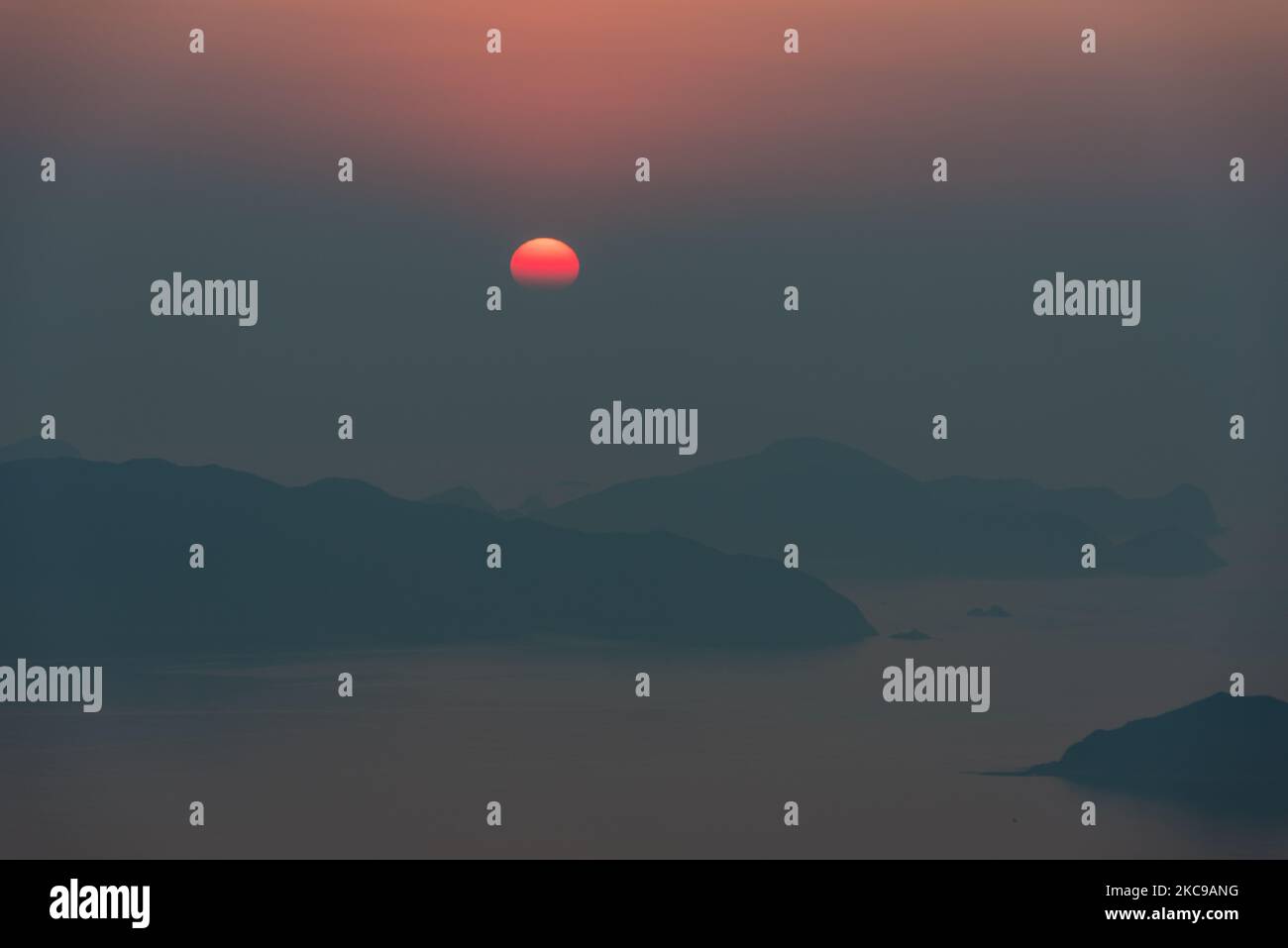 A red sun rises above the South China Sea on the 4th day of Lunar New ...
