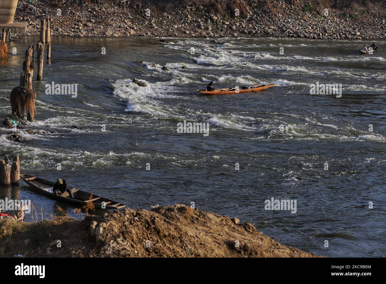 Kashmiri men busy in fishing in river Jehlum in Sopore town of District ...