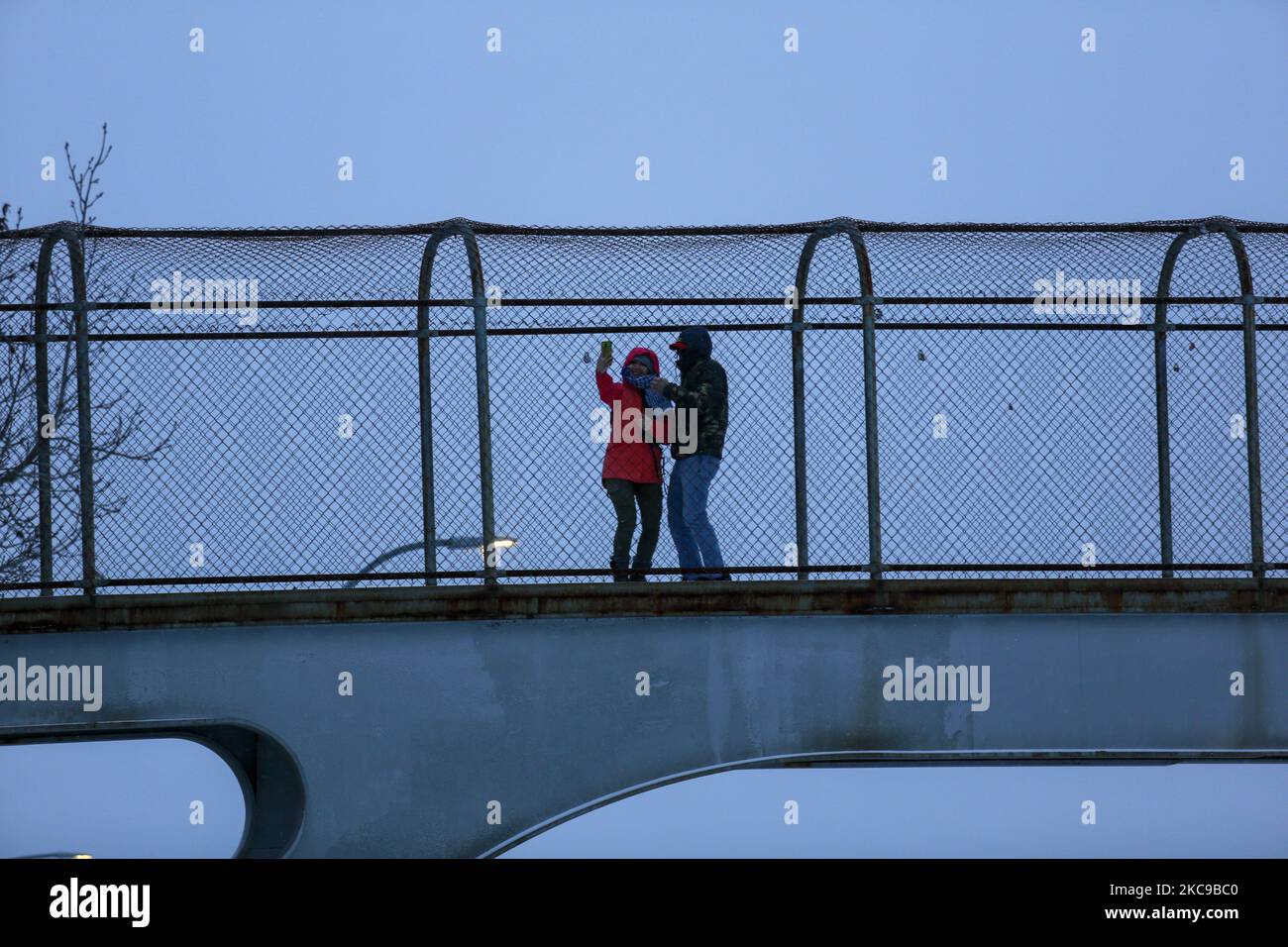 A couple takes a selfie in Buffalo Bayou Park in Houston, Texas early ...