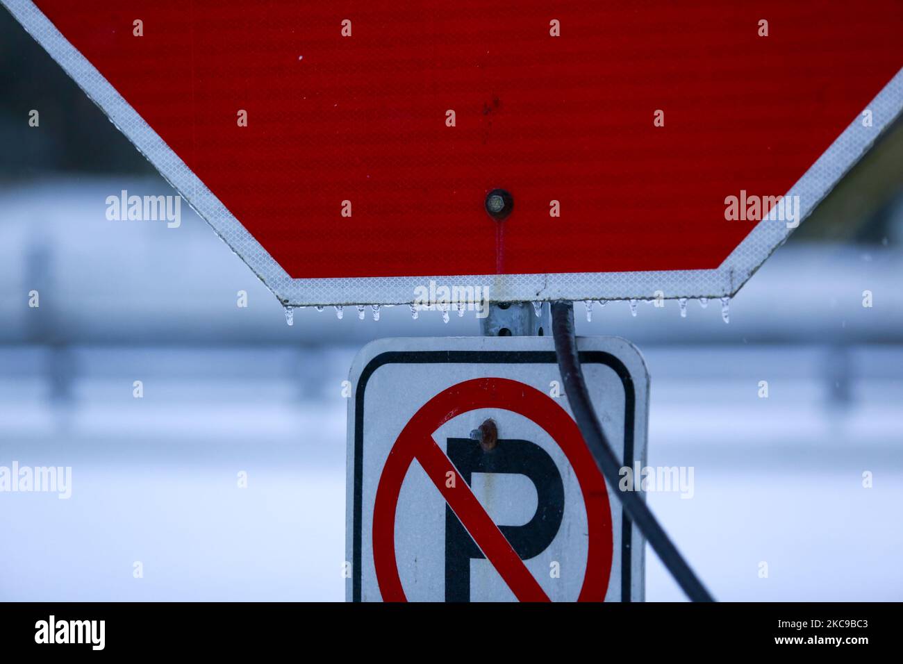 A frozen stop sign near Buffalo Bayou Park in Houston, Texas early on ...