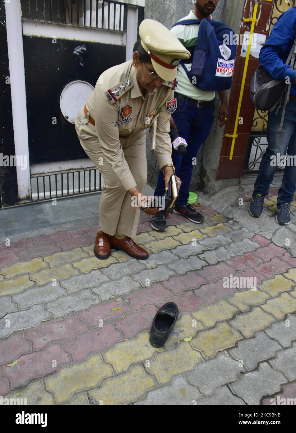 AMRITSAR, INDIA - NOVEMBER 4: Police personnel investigate the crime ...