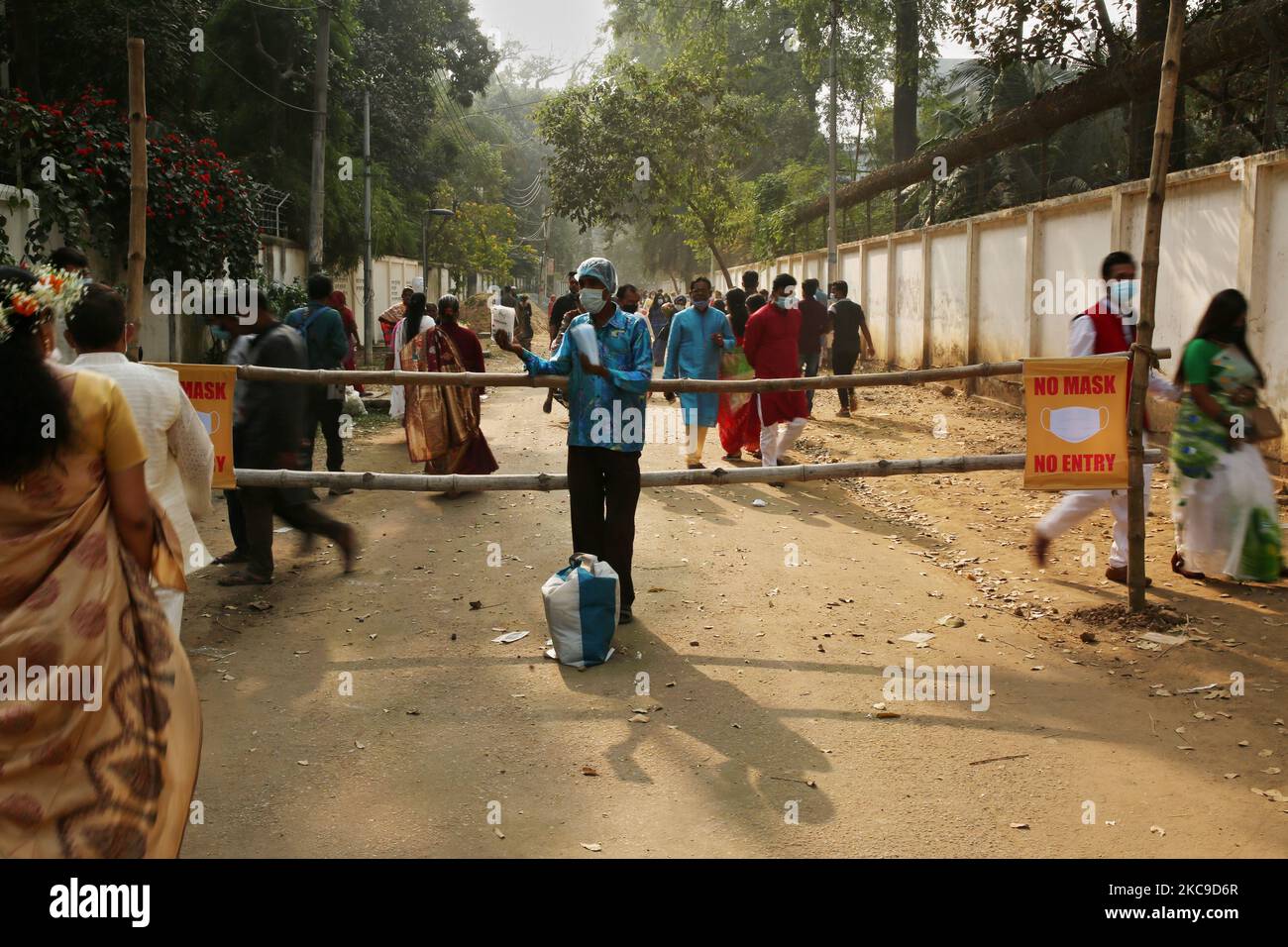 A mask seller waiting for customers as he sells masks at the entrance ...