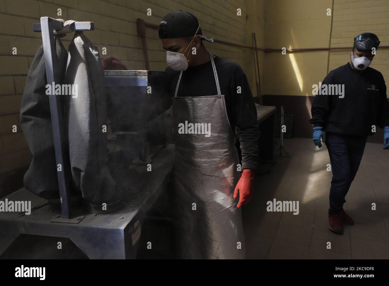 A worker at the Nezahualcóyotl Municipal Crematorium, located in the ...