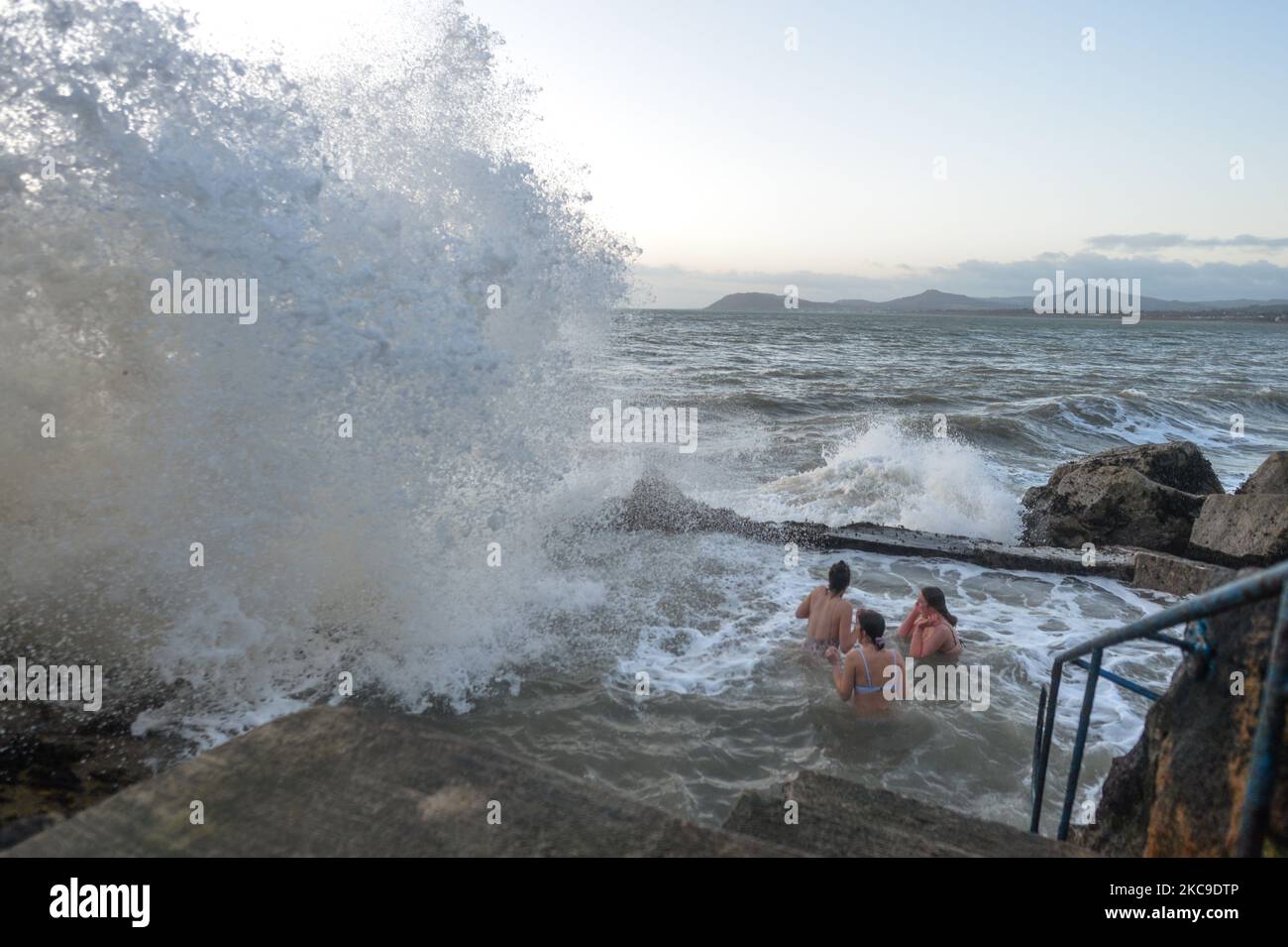 Three young ladies take a dip in the sea at Vico's Bathing Site, Hawk ...