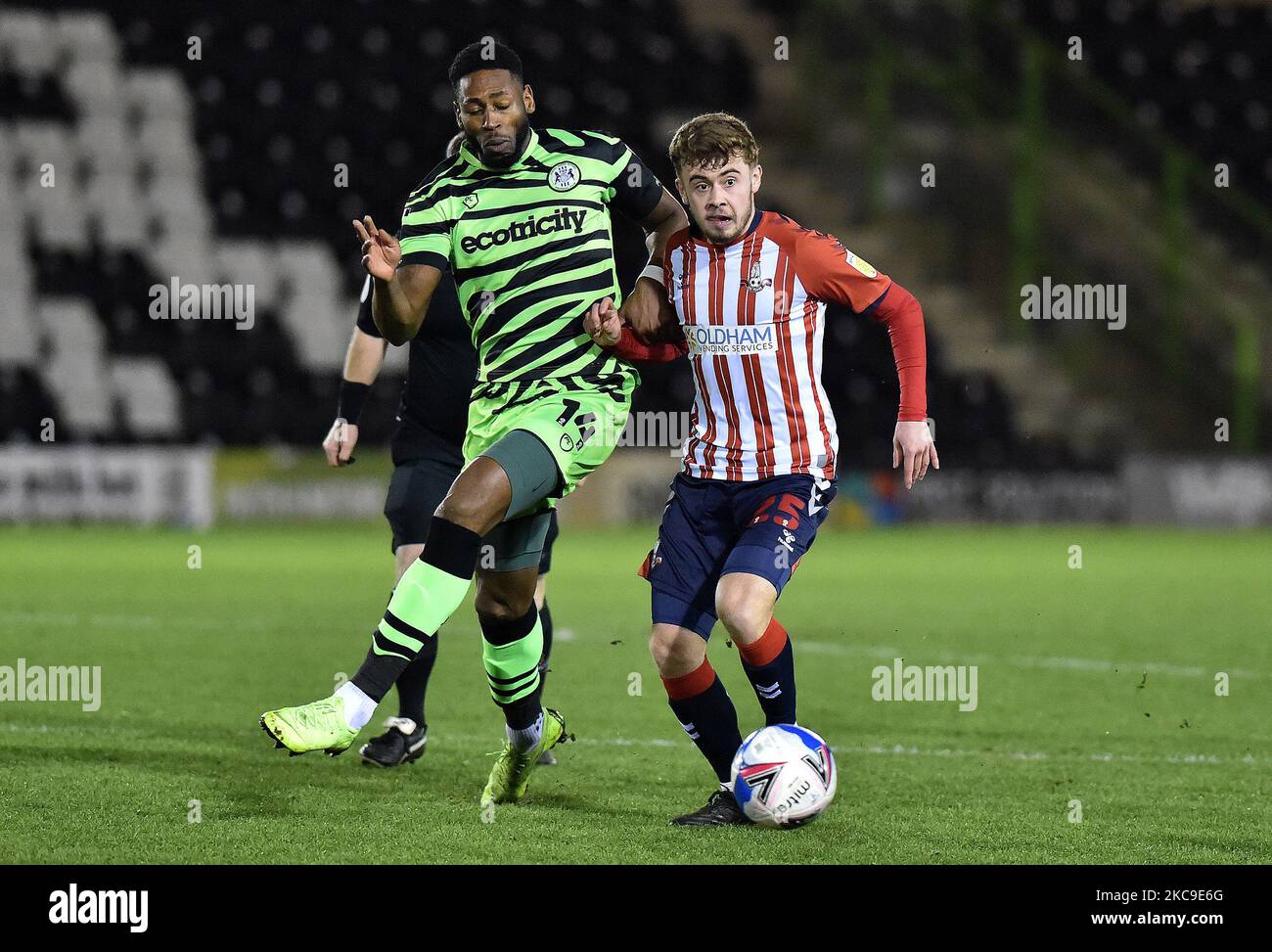 Oldham Athletic's Alfie McCalmont tussles with Jamille Matt of Forest ...