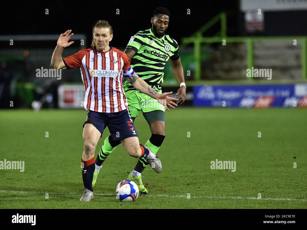 Carl Piergianni tussles with Jamille Matt of Forest Green Rovers during ...