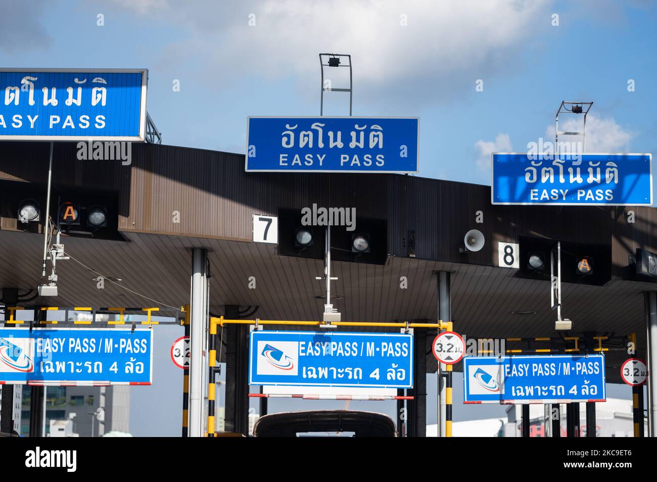 A view of blue easy-pass road signs at a checkpoint Stock Photo - Alamy