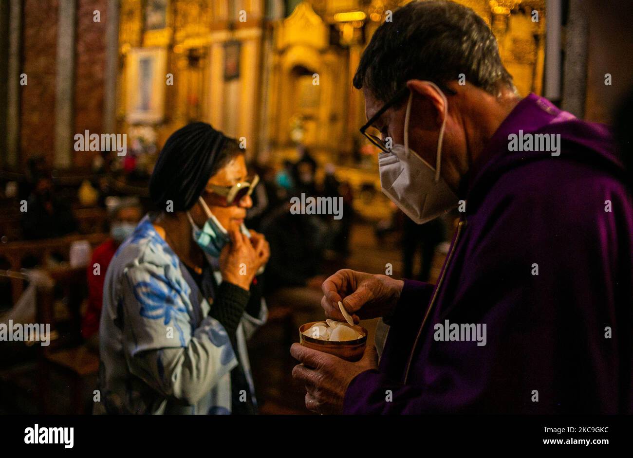Priest placing ash, ritual of the beginning of Lent in the Catholic ...
