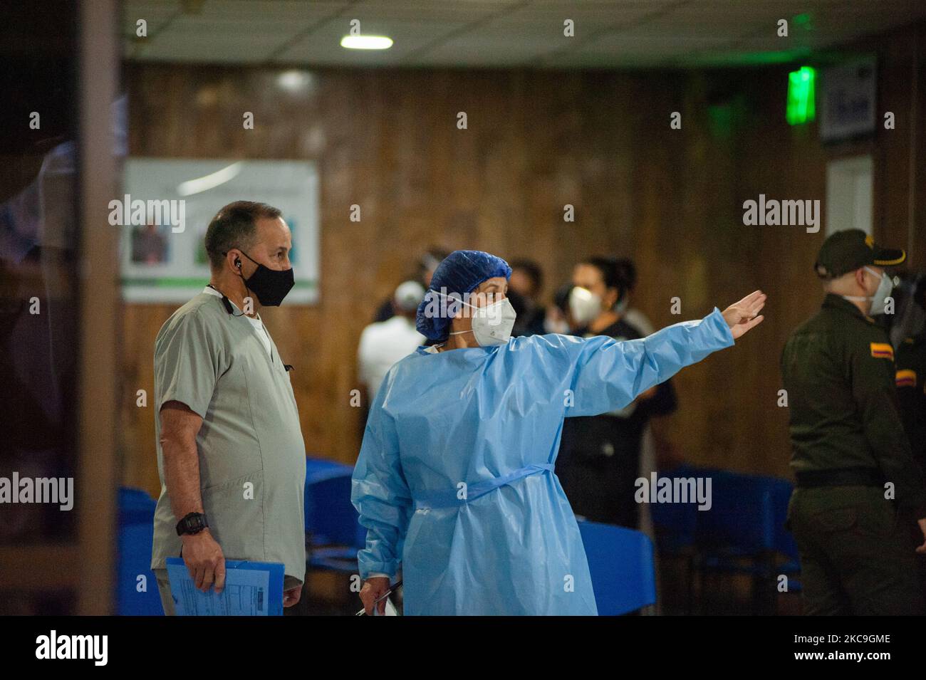 Health workers from the Colombian Police Hospital prepare to start the ...